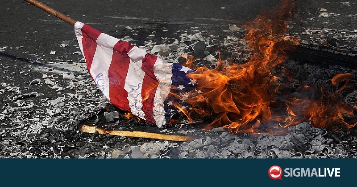 Διαδηλωτής συνελήφθη κοντά στον Λ. Οίκο διότι έβαλε φωτιά σε σημαία των ...
